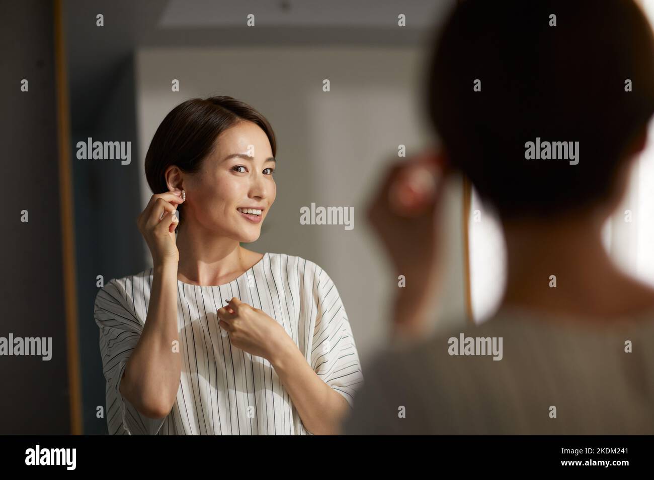 Japanese woman getting ready at home Stock Photo - Alamy