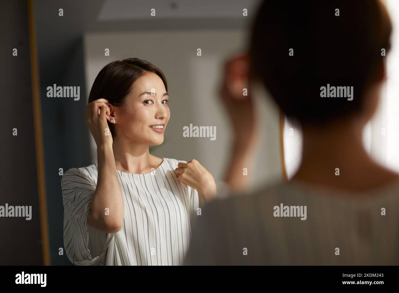 Japanese woman getting ready at home Stock Photo - Alamy