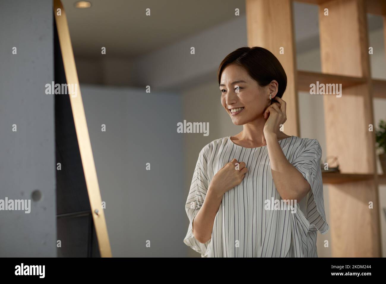 Japanese woman getting ready at home Stock Photo - Alamy