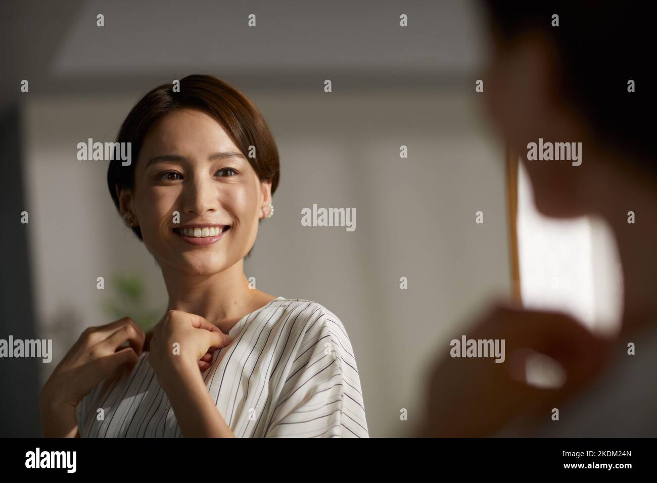 Japanese woman getting ready at home Stock Photo - Alamy