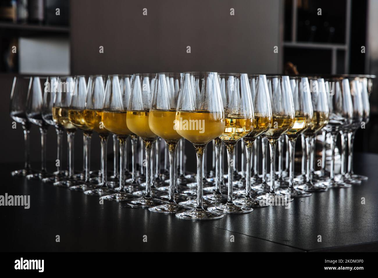 A lot of wine glasses with a cool delicious champagne at the bar ...