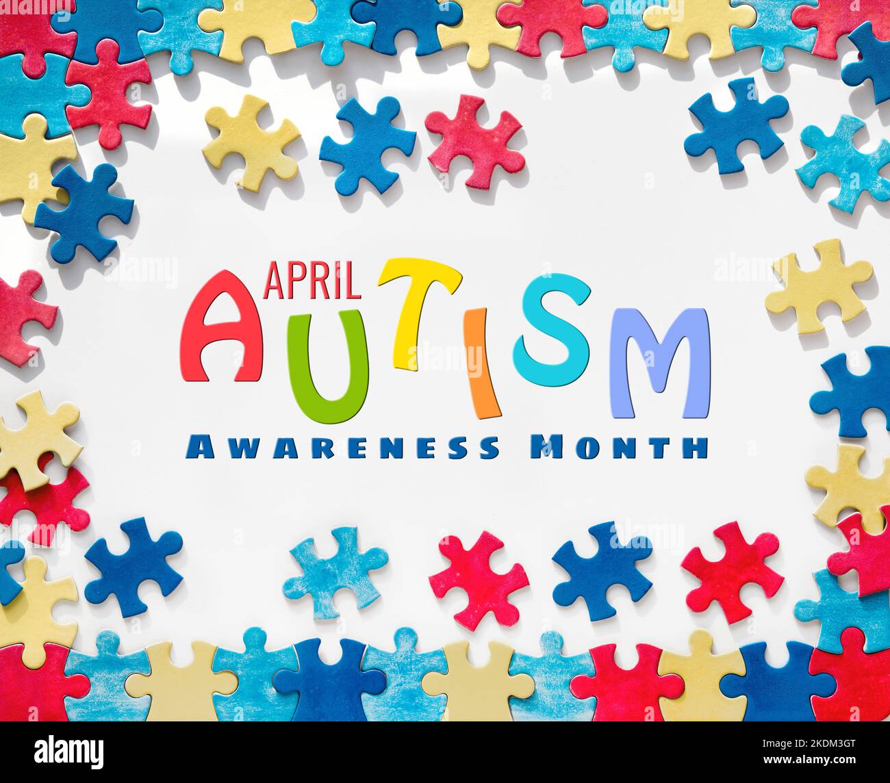 World Autism Awareness Day, April 2 written on canvas with puzzle ...