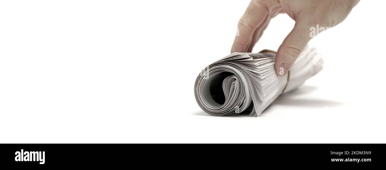 Hand touching newspaper rolled up isolated on white for news stories ...