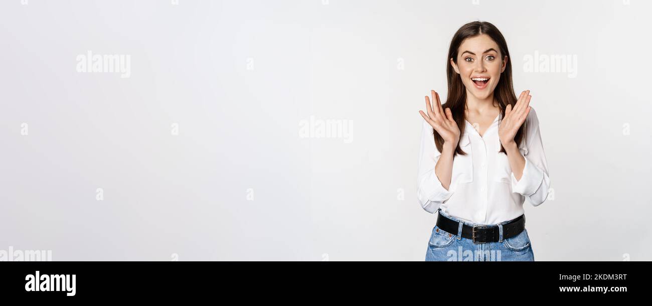 Enthusiastic laughing woman, smiling amused, clapping hands, applausing ...