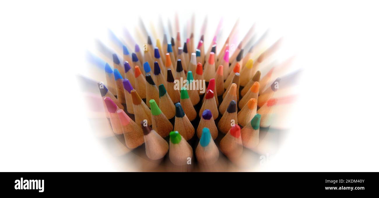 Large pile amount of colored pencils in a tube holder for art and ...