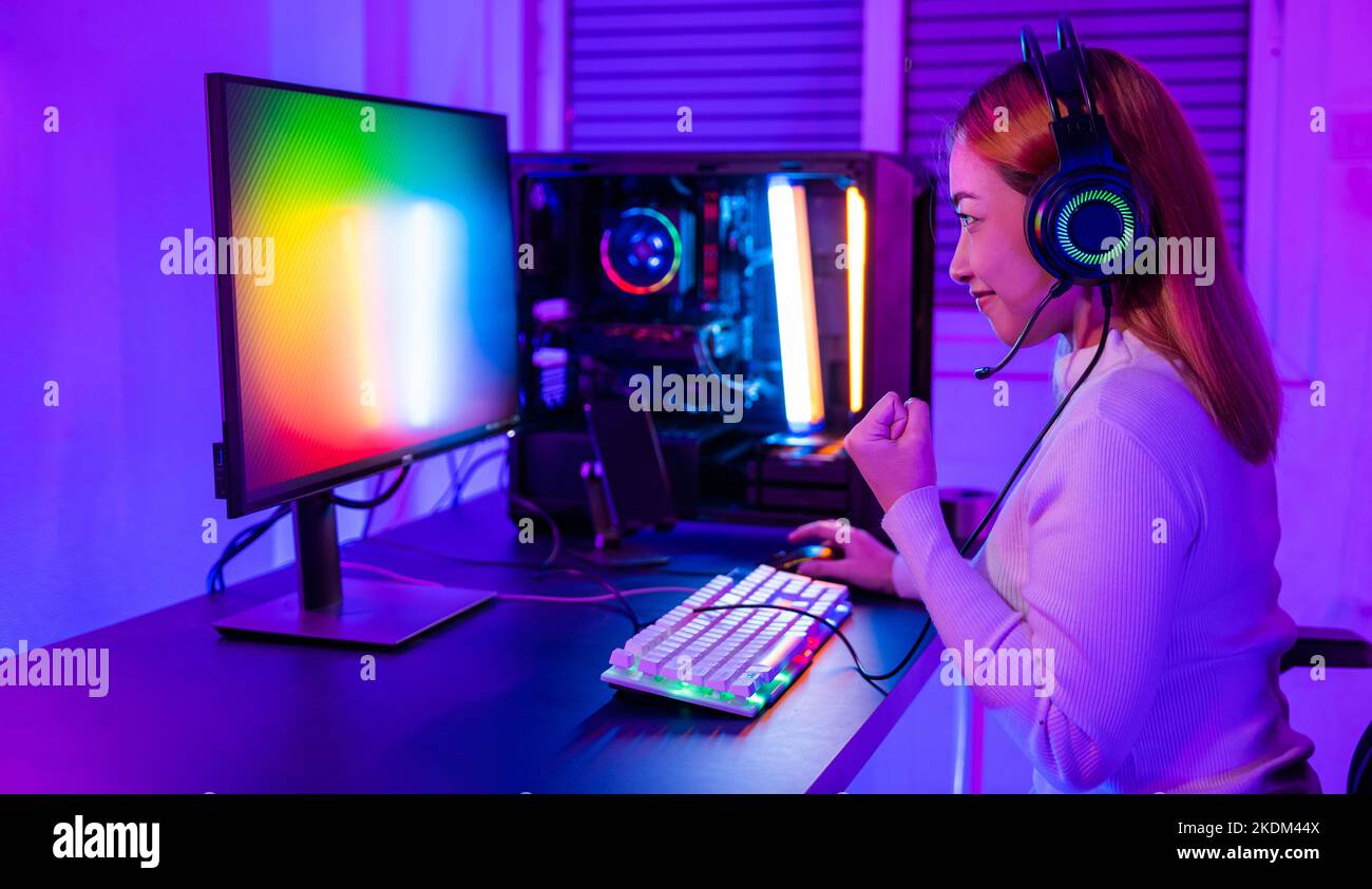 Asian gamer playing online video game excited on desktop computer Stock ...