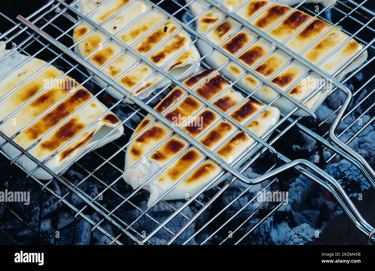 Tasty grilled squid tubes hi-res stock photography and images - Alamy