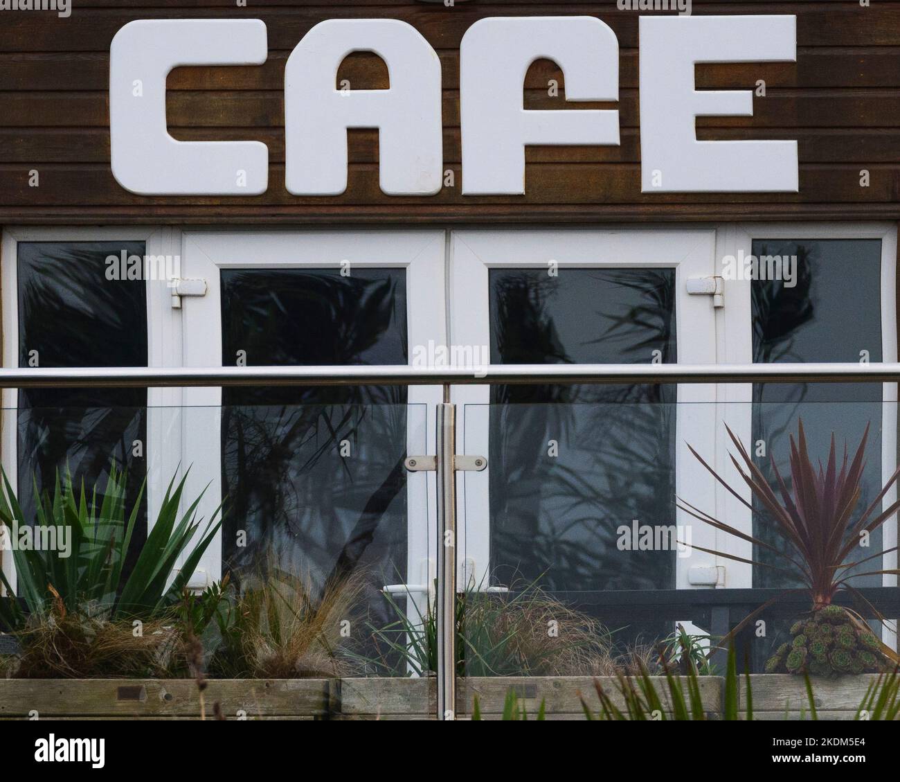 Sunset Surf sign and café sign - Larger white logo sign Stock Photo - Alamy