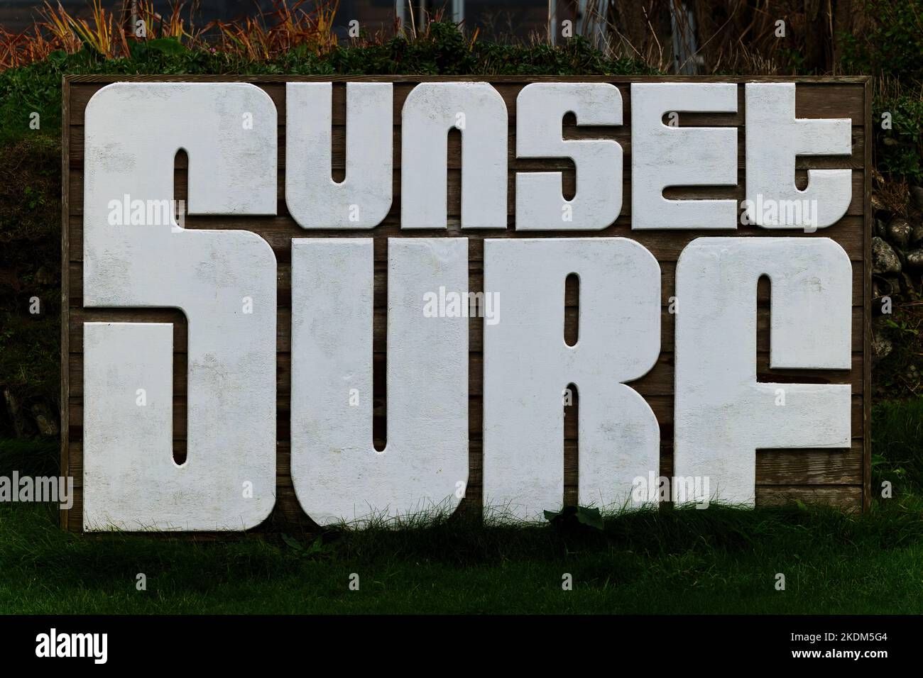 Sunset Surf sign and café sign - Larger white logo sign Stock Photo - Alamy