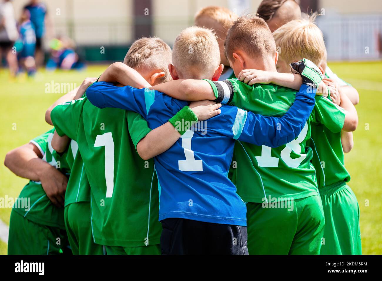 Happy boys play team sport. Kids smiling in school sports team ...