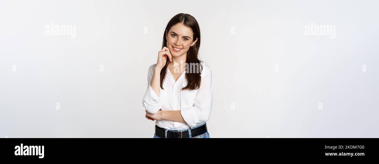 Smiling young businesswoman, female entrepreneur in white shirt, cross ...
