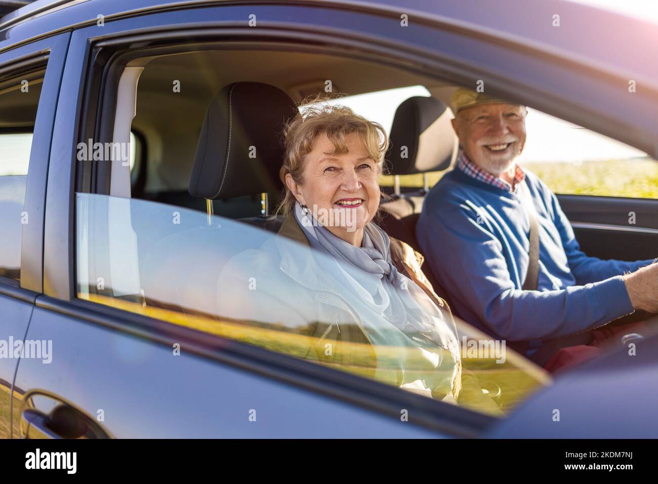 Senior couple driving a car Stock Photo - Alamy