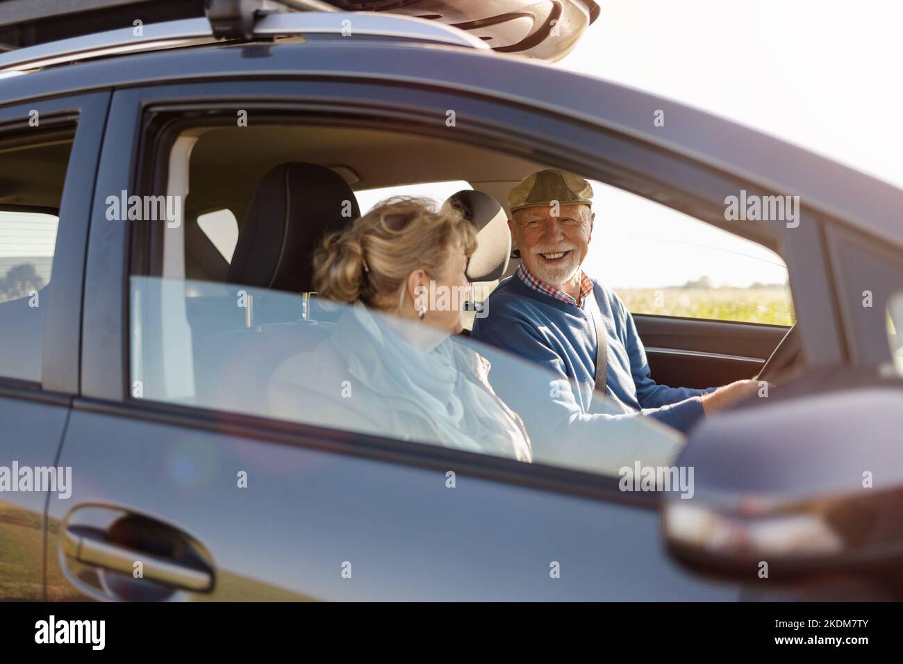 Senior couple driving a car Stock Photo - Alamy