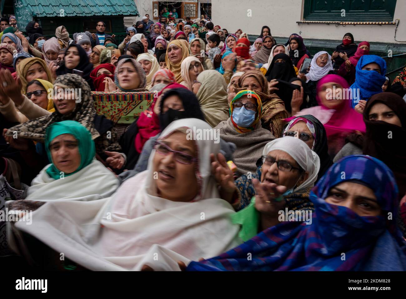 Kashmiri Muslims cry and raise their hands while beseeching for ...