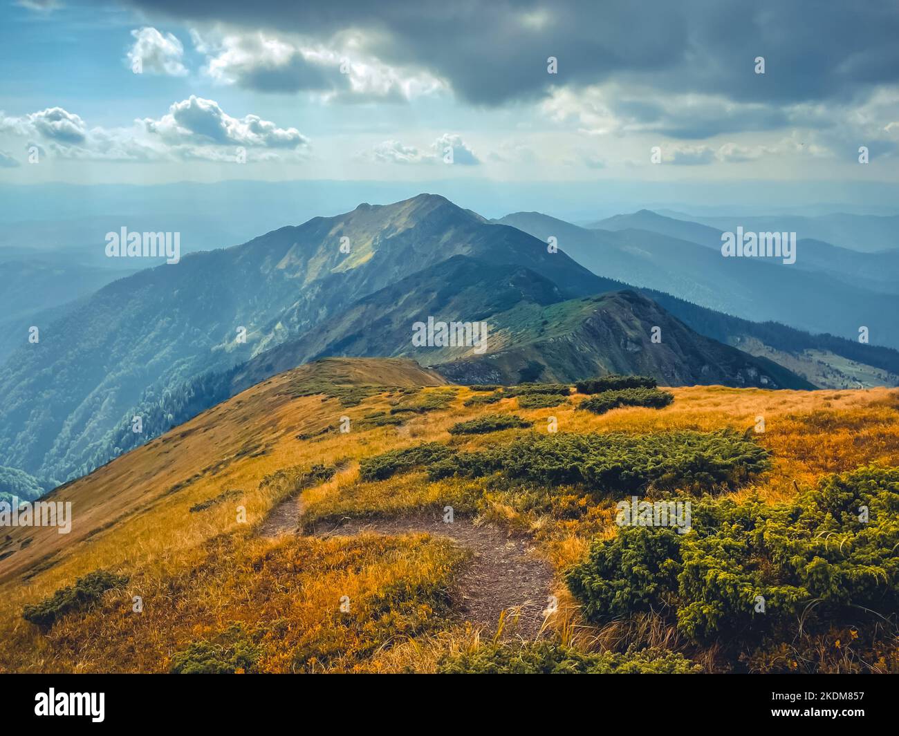 Hiking tourist trail in high mountains under blue sky. Wonderful autumn ...