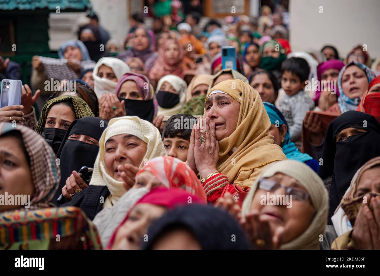 Kashmiri Muslims cry and raise their hands while beseeching for ...