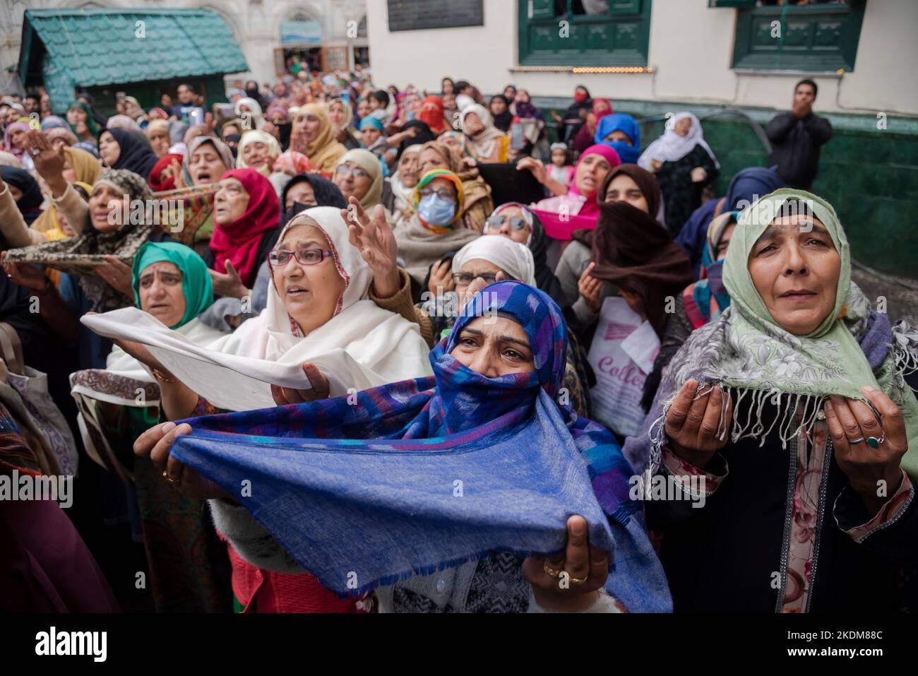 Kashmiri Muslims cry and raise their hands while beseeching for ...