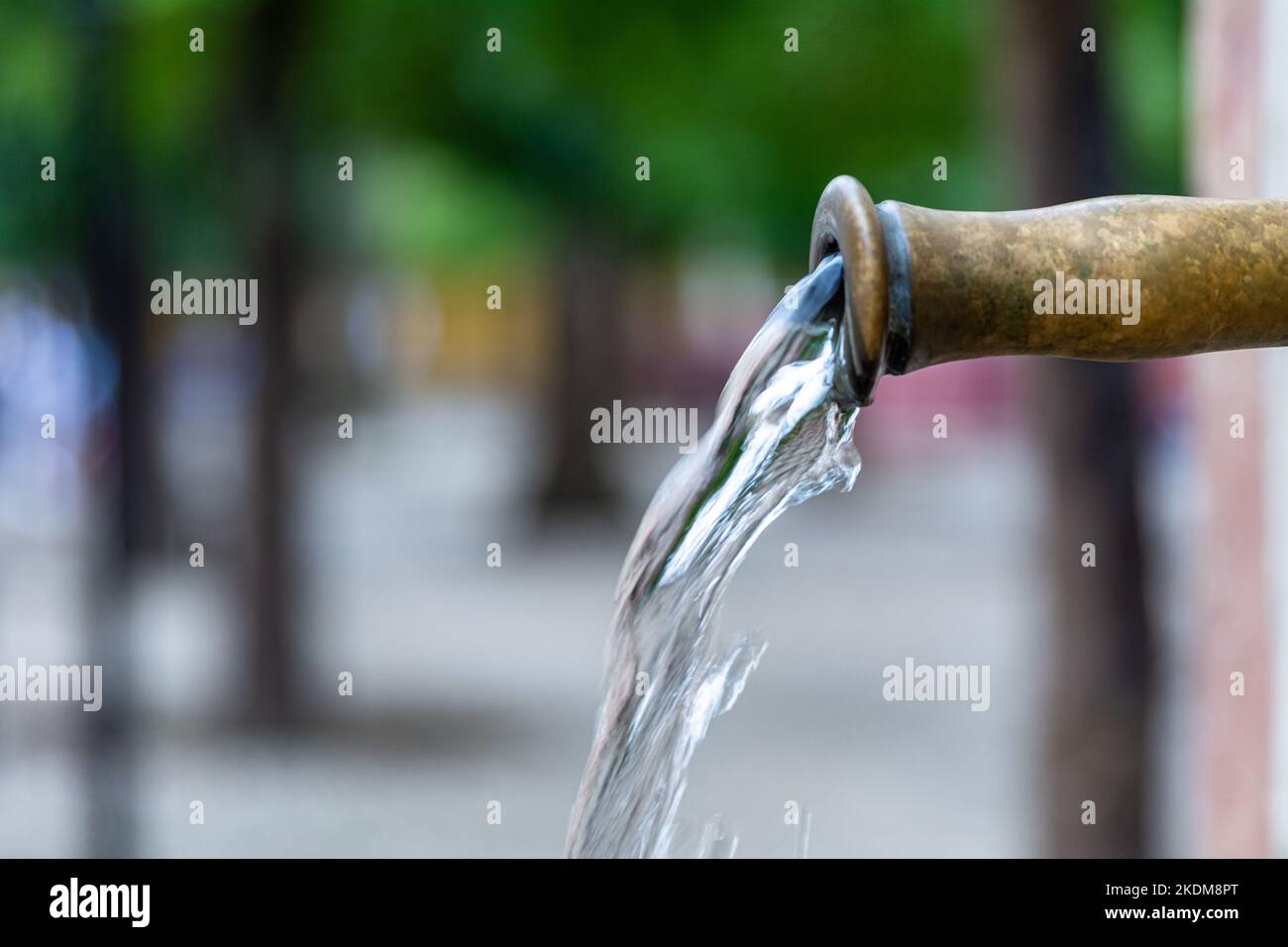Close-up of water flowing out of a public drinking fountain Stock Photo ...