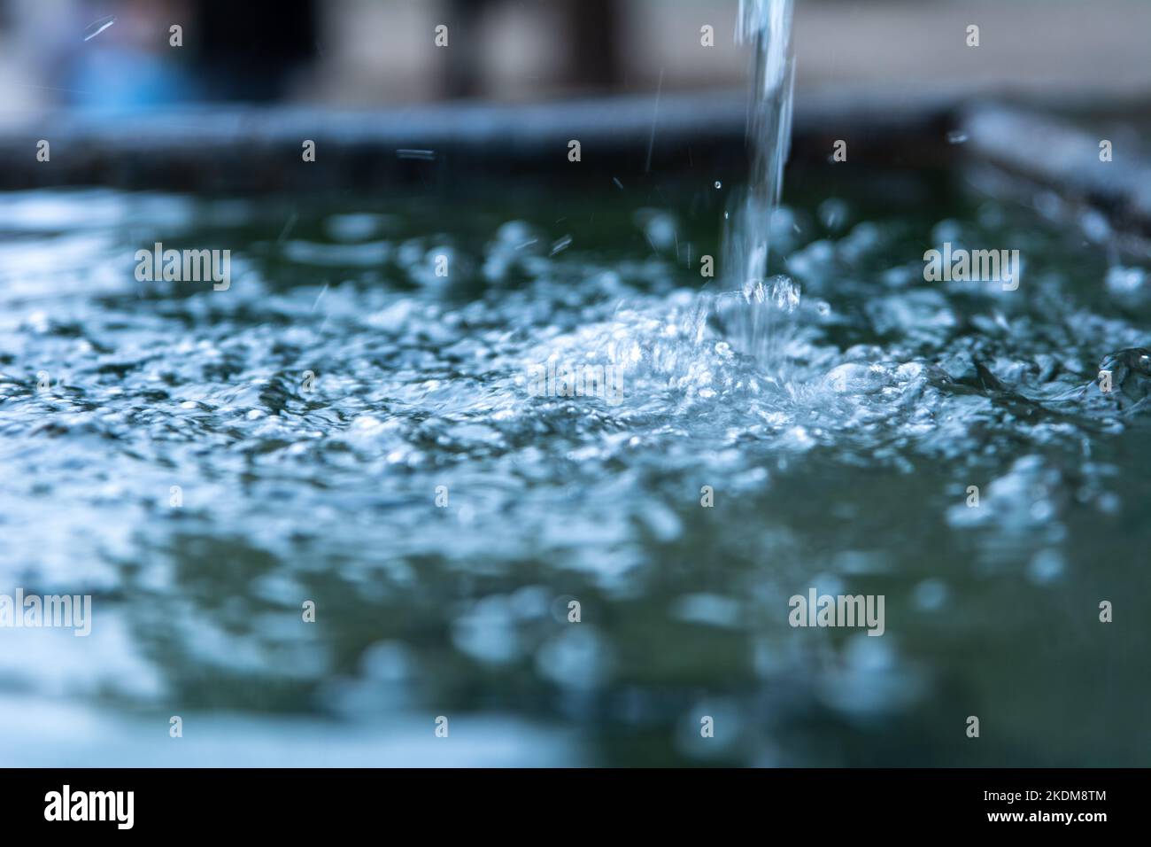 Close-Up of Water which is poured into a pool Stock Photo - Alamy