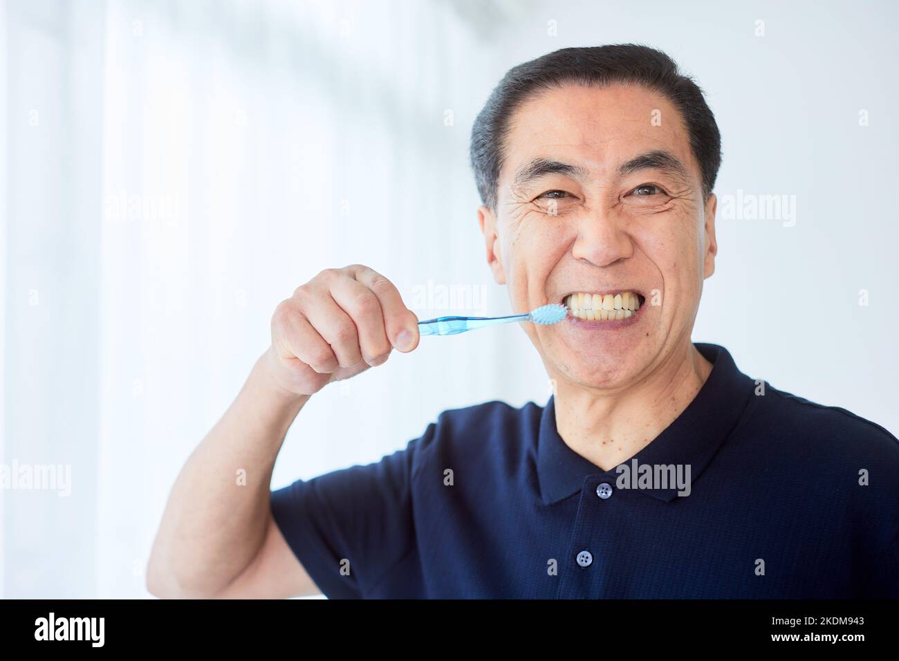 Japanese senior man brushing teeth Stock Photo - Alamy