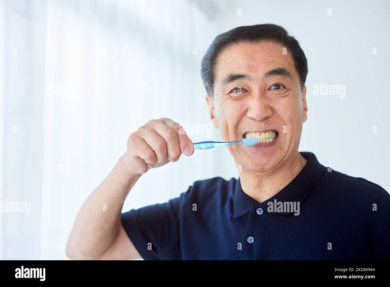 Japanese senior man brushing teeth Stock Photo - Alamy