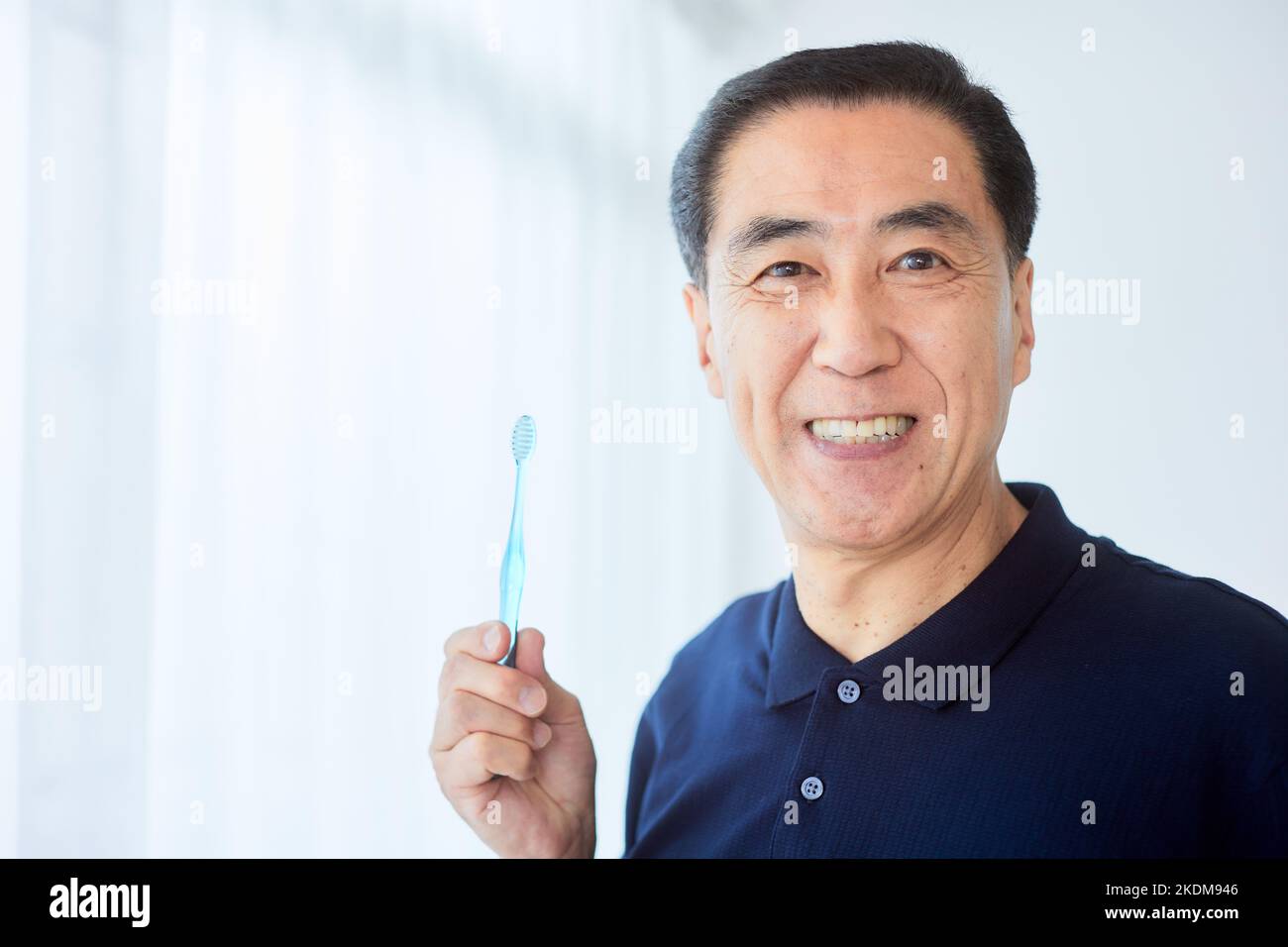 Japanese senior man brushing teeth Stock Photo - Alamy