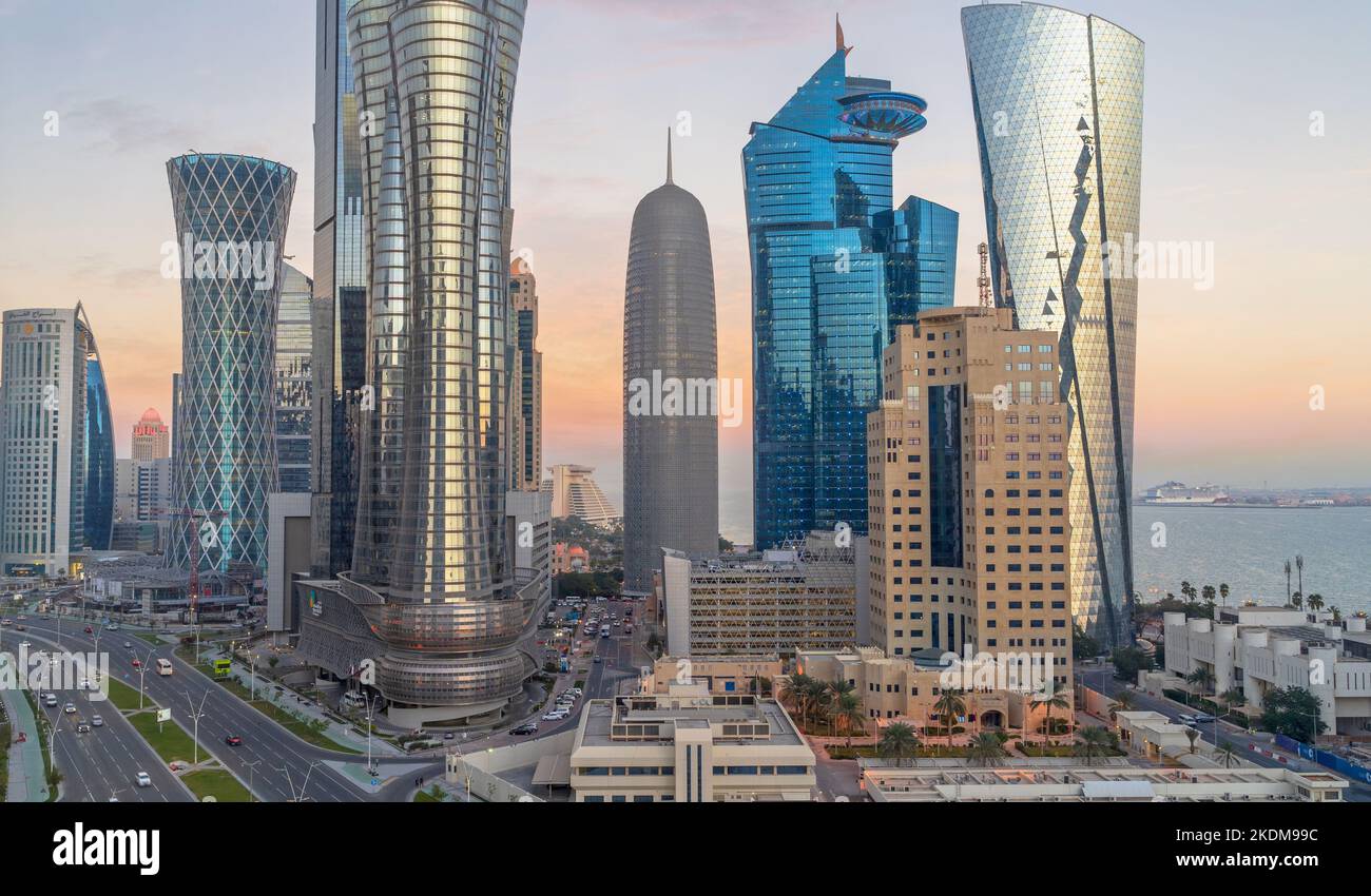 Doha, Qatar- March 03,2022 : Qatar skyline during sunset with colorful ...