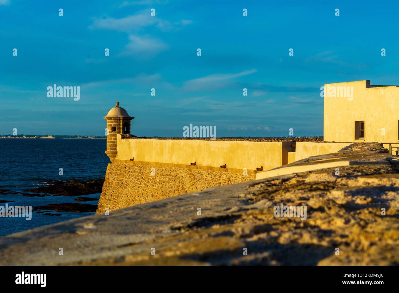 Watchtower of an ancient fortress on a coastal shore Stock Photo - Alamy