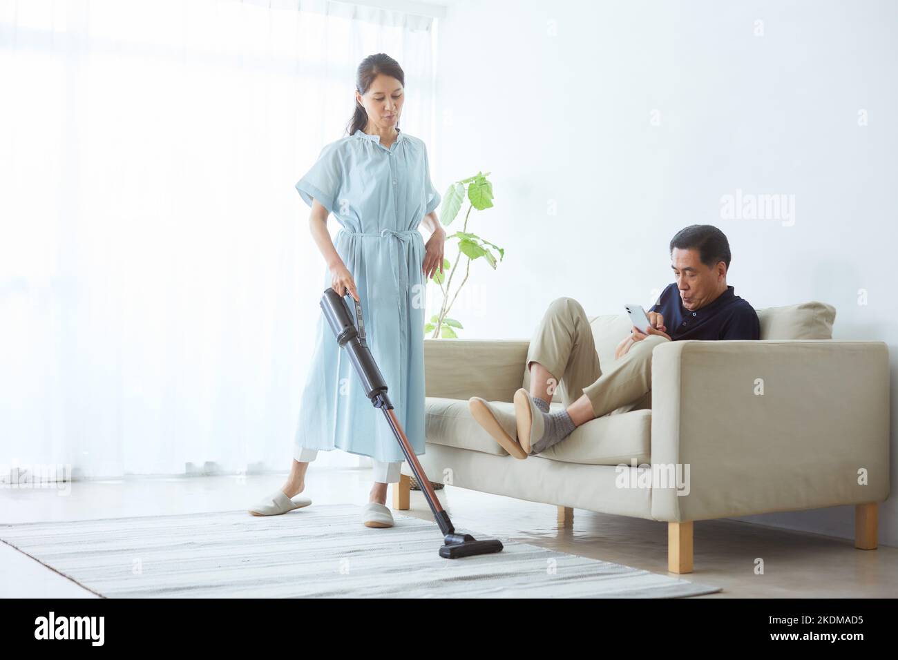 Japanese senior woman cleaning at home Stock Photo - Alamy