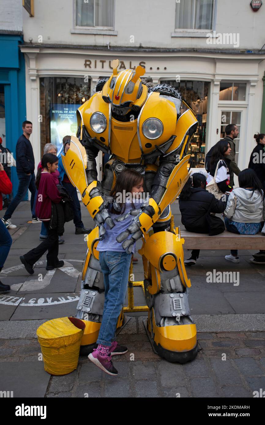 Young girl hugging Bumblebee street performer. London England Stock ...