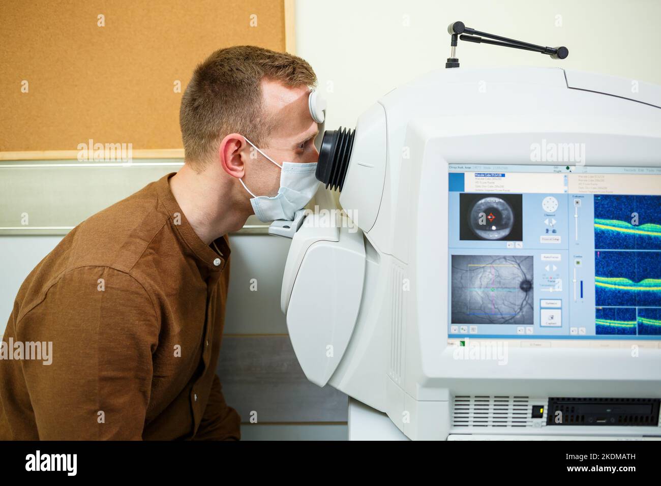 Professional medical equipment scanning the patient's eyes. The device ...