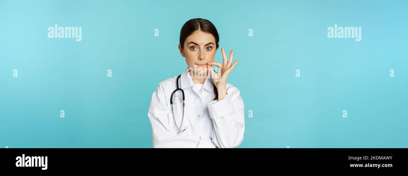 Patient doctor privilege.Young woman healthcare worker showing mouth ...