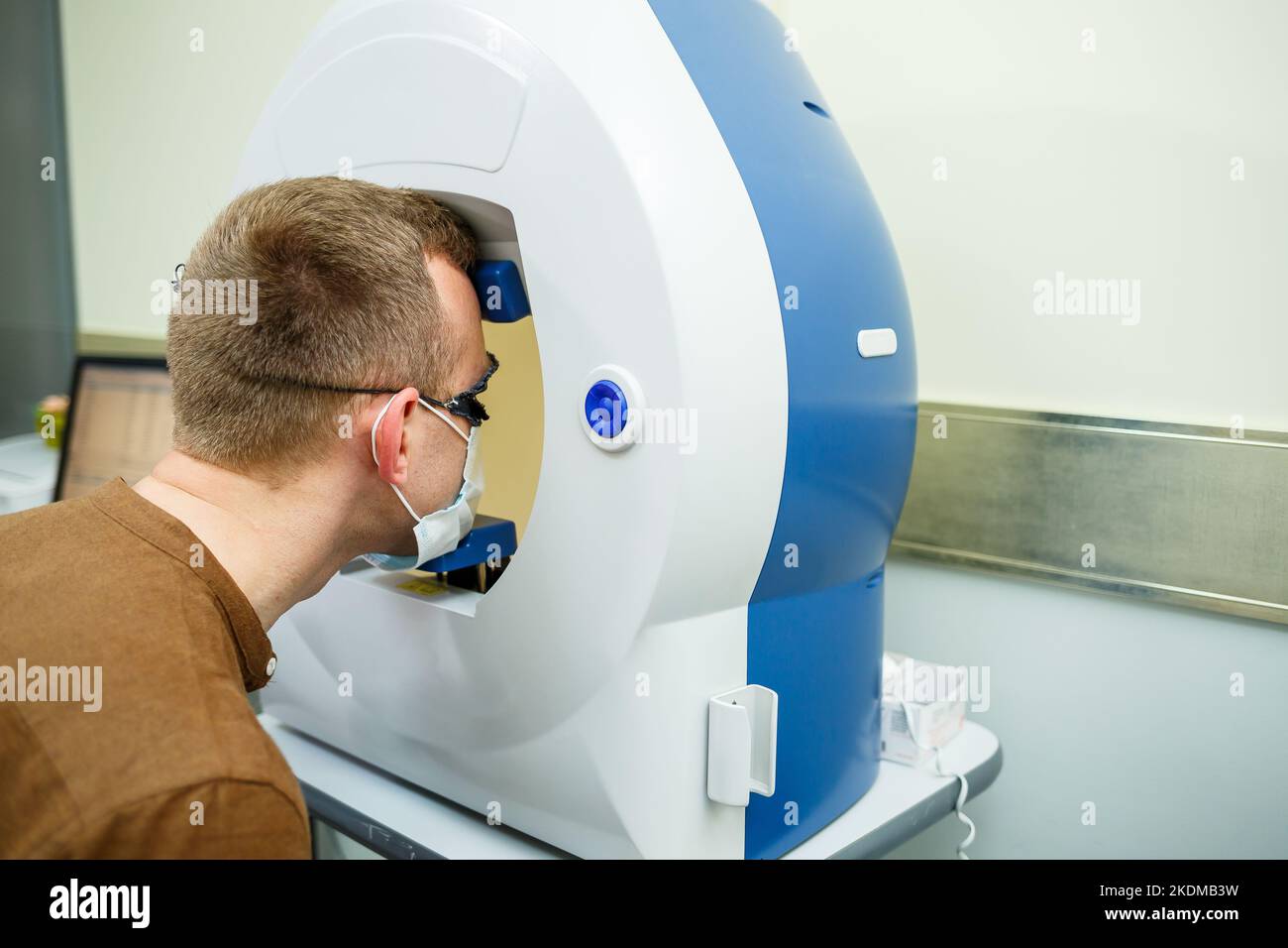 Professional medical equipment scanning the patient's eyes. The device ...