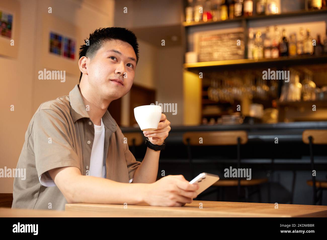 Japanese man at a cafe Stock Photo - Alamy