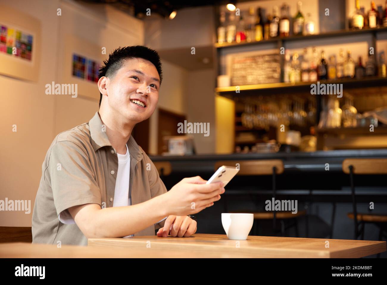 Japanese man at a cafe Stock Photo - Alamy