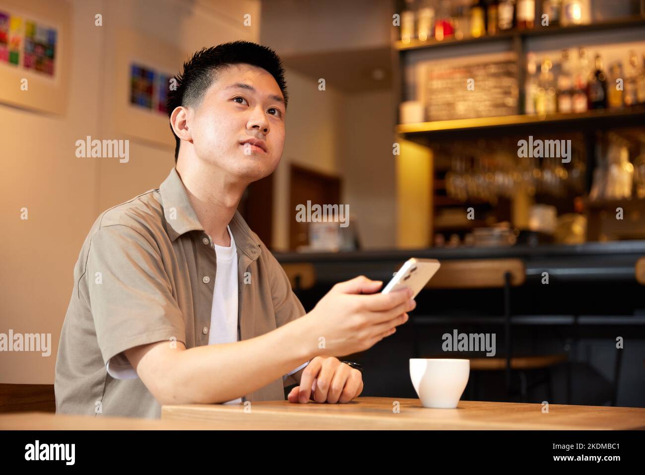 Japanese man at a cafe Stock Photo - Alamy