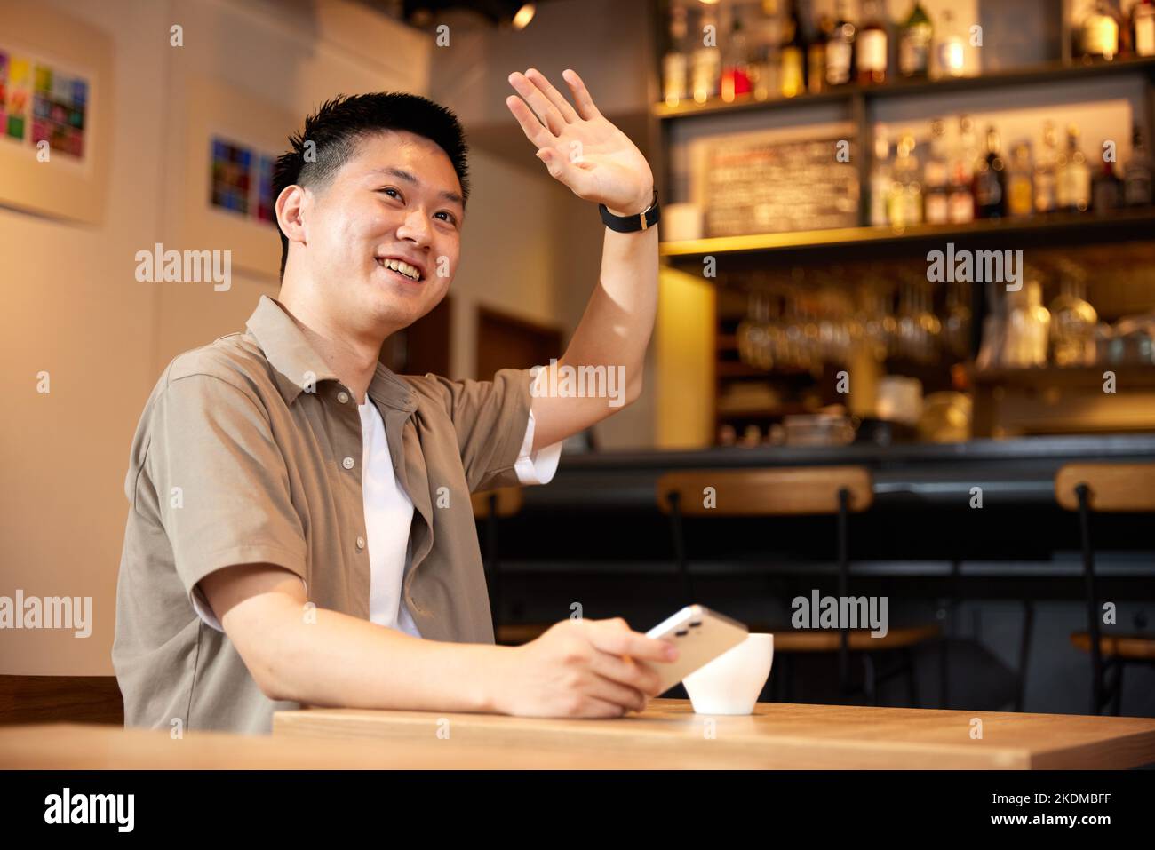 Japanese man at a cafe Stock Photo - Alamy