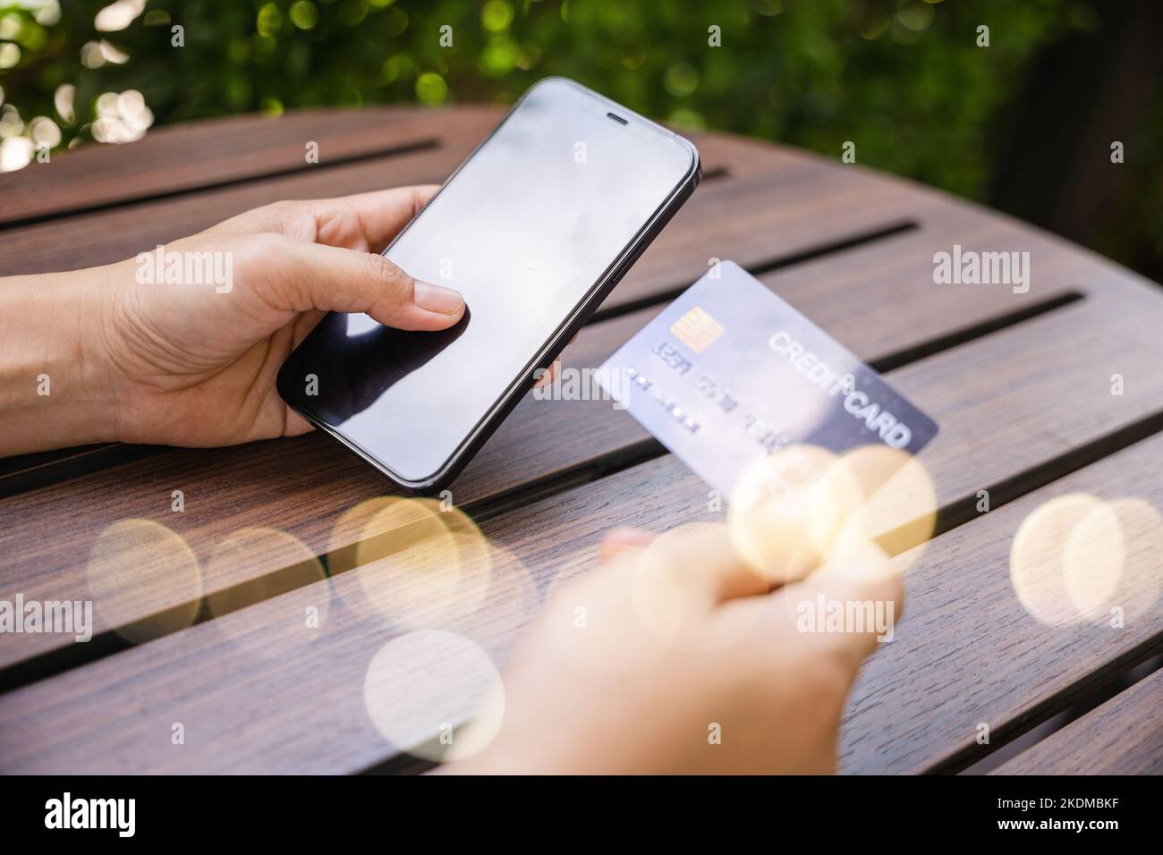 woman using credit card and smartphone during slide screen for finding ...