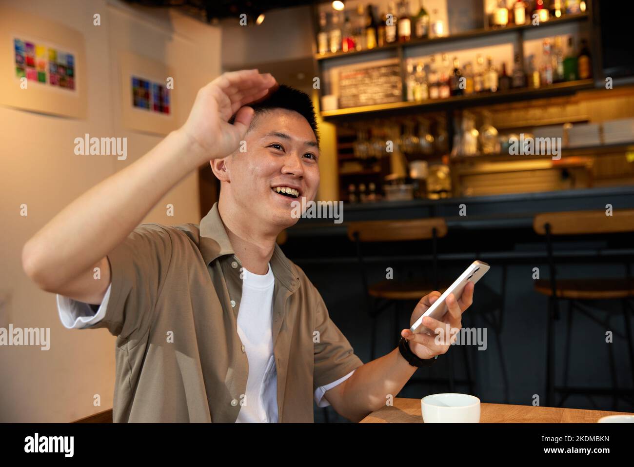 Japanese man at a cafe Stock Photo - Alamy