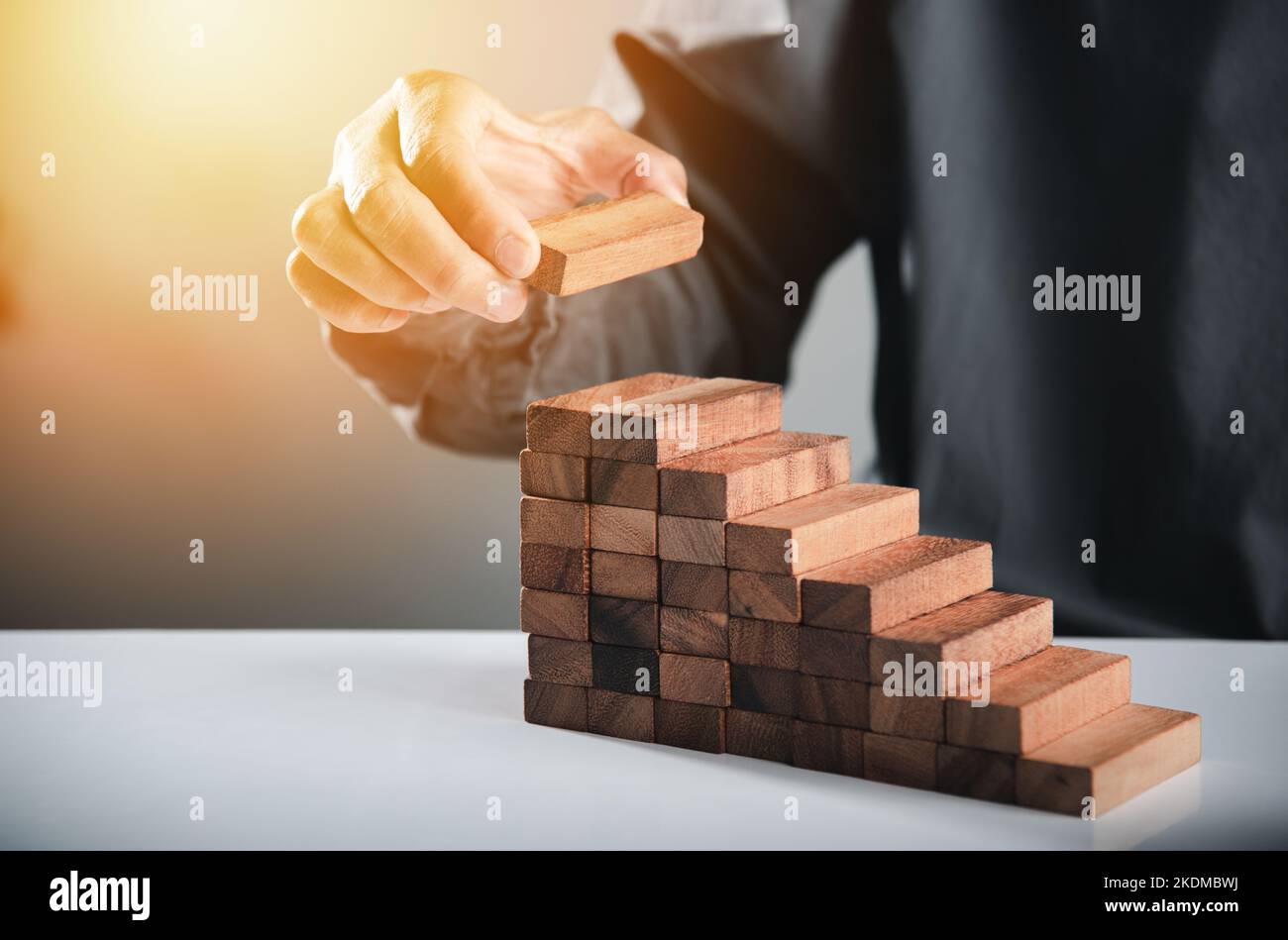 Business hand arranging put wooden block stacking step stair growth ...