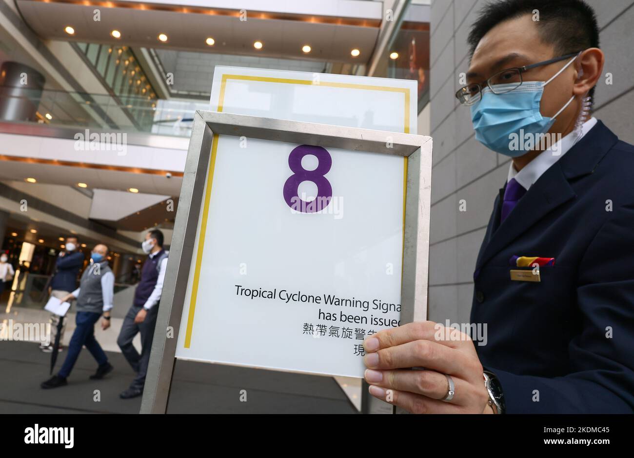 A staff change notice of No.8 typhoon warning signal at IFC mall ...