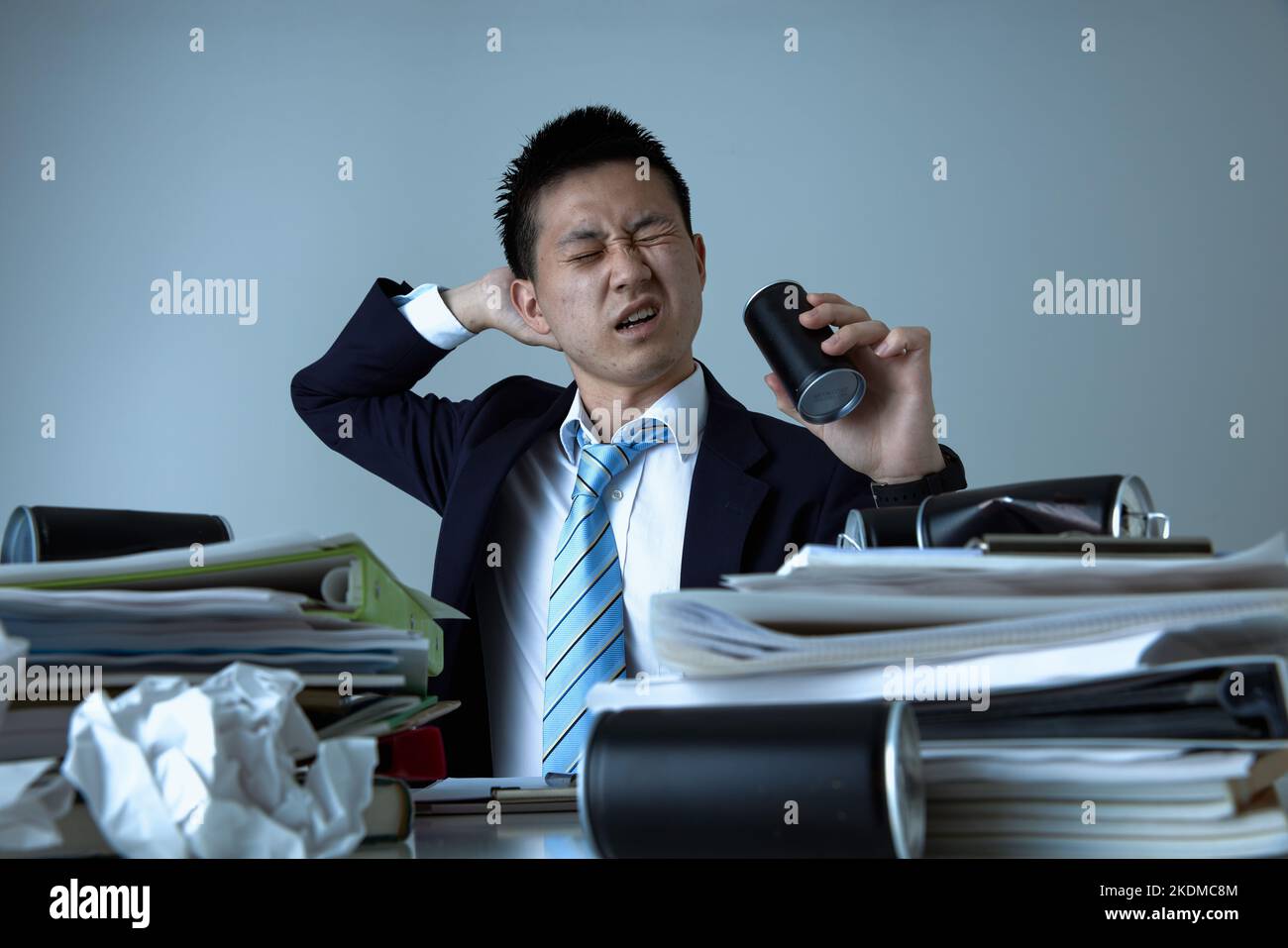 Tired Japanese businessman Stock Photo - Alamy
