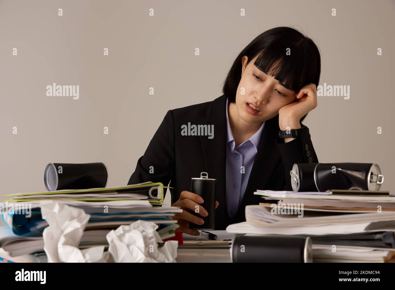 Tired Japanese businesswoman Stock Photo - Alamy