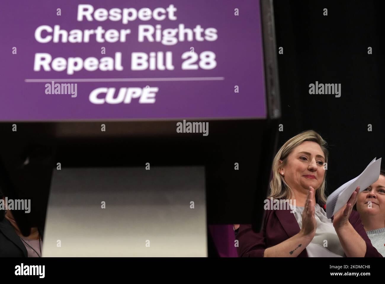 CUPE-OSBCU president Laura Walton applauds during a press conference in ...