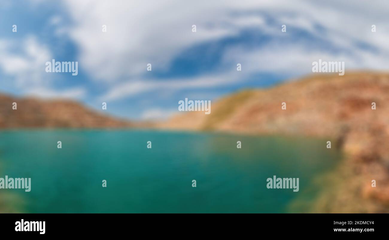 Abstract defocused blured background Emerald lake in a flooded quarry ...