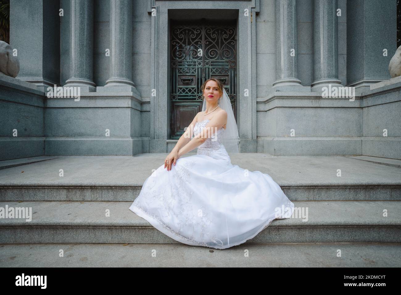 Bride with Attitude Standing in Front of a Granite Building Stock Photo ...