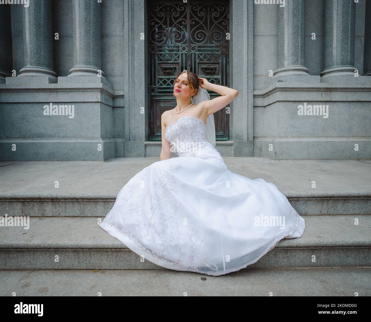 Bride with Attitude Standing in Front of a Granite Building Stock Photo ...