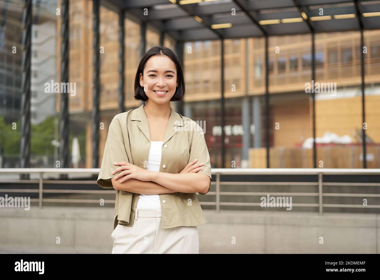 Portrait of beautiful young woman in casual clothes, smiling, posing ...