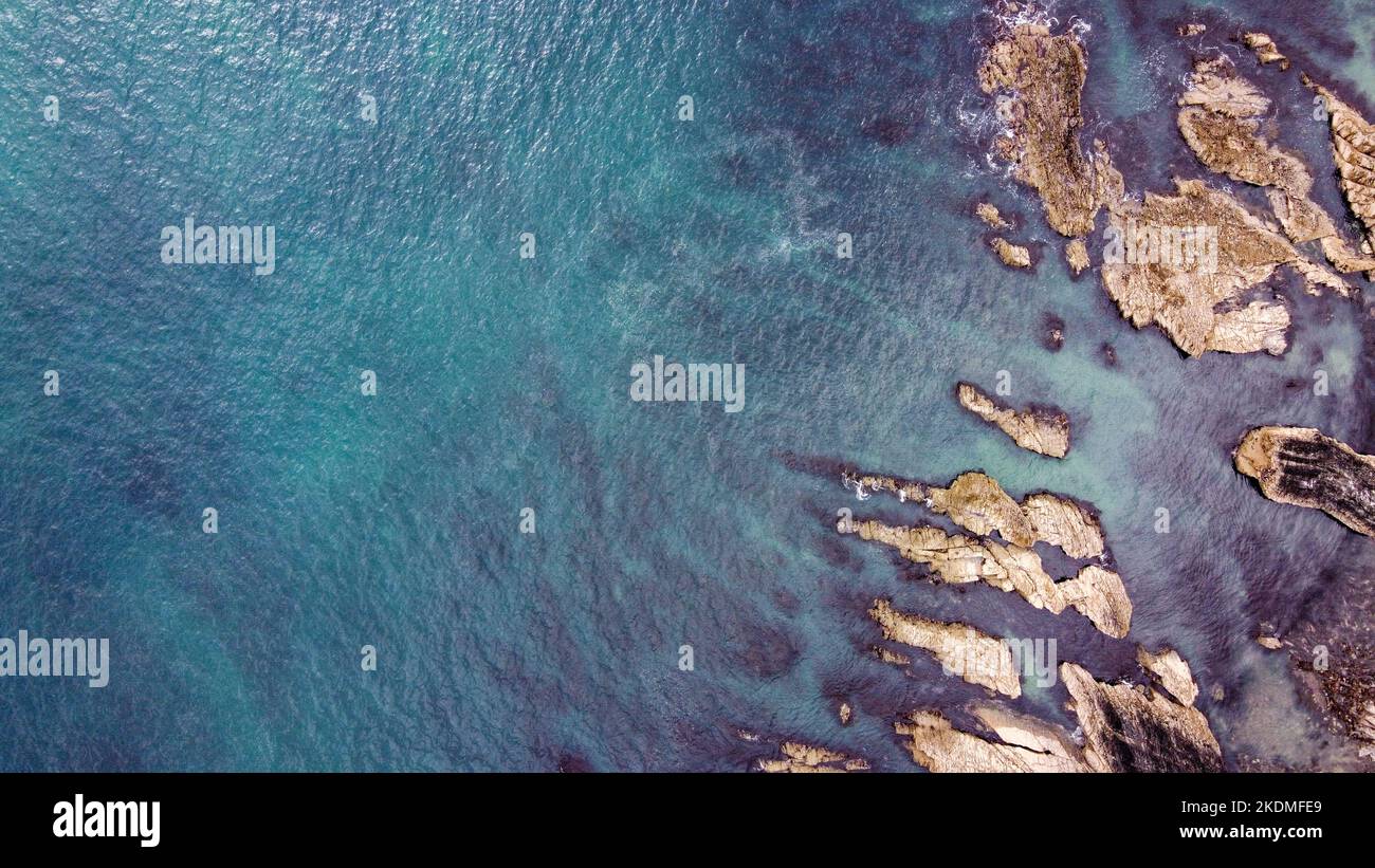 Rocks among the turquoise sea. Seascape, top view. Waters of the ...
