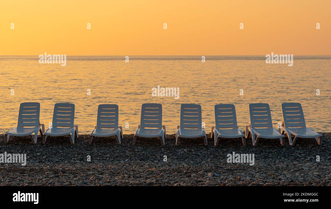 Sunbed on the beach with beautiful sunset background. Seascape Stock ...